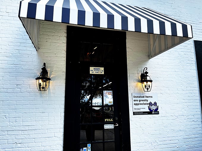 The blue-and-white awning entrance&mdash;like the gateway to Narnia, but instead of talking lions, you'll find talking points for your next home redesign.