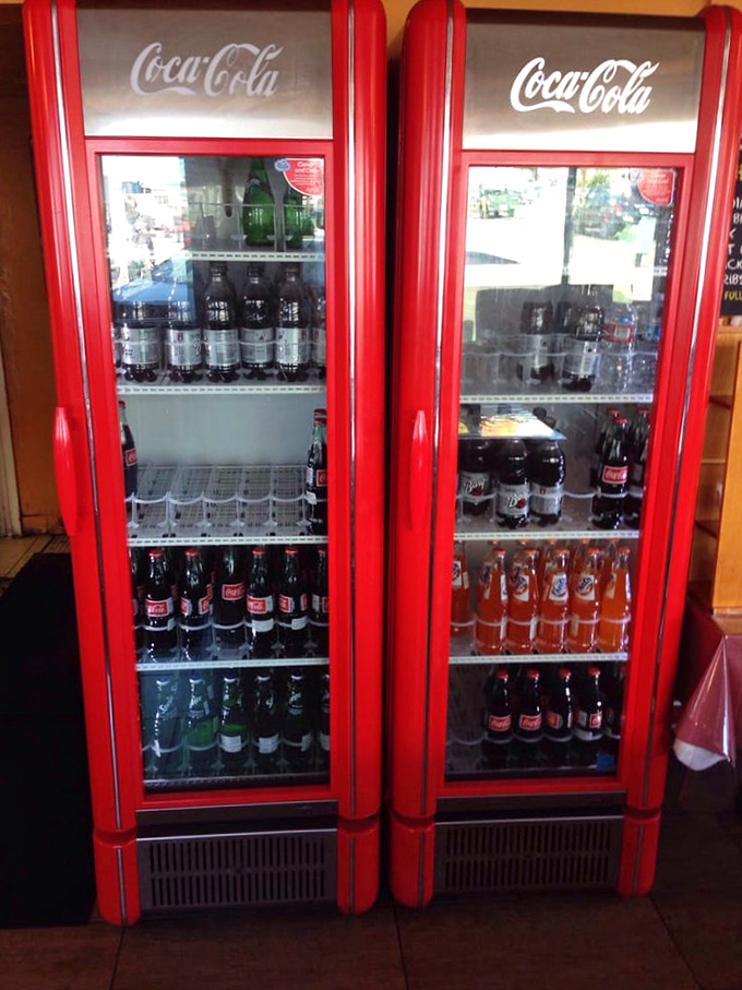 The vintage Coca-Cola fridges aren't just for show—they're keeping your beverages ice-cold, ready to extinguish the pleasant fire of Texas spices.
