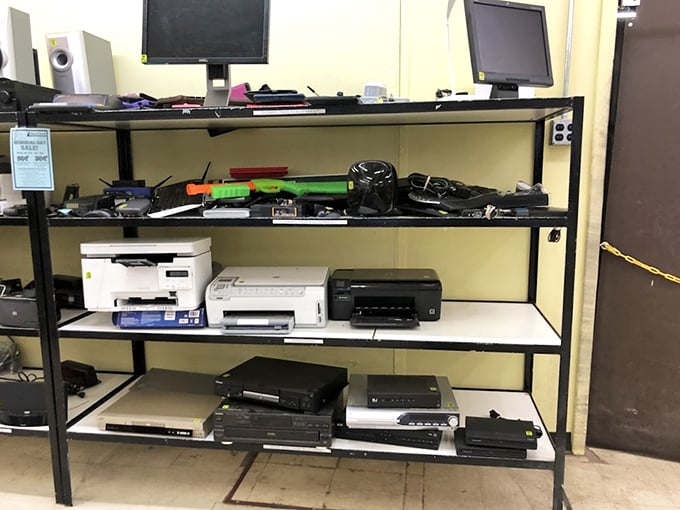 The electronics graveyard where yesterday's cutting-edge technology finds new purpose. That printer has more life left than most politicians' promises.
