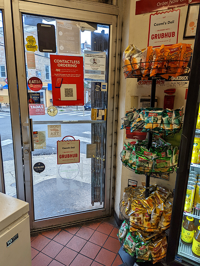 The entrance to hoagie heaven, where chip racks stand sentinel and delivery options abound. Cross this threshold and enter sandwich nirvana.