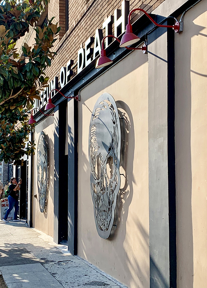 Skull sculptures adorn the exterior walls, casting dramatic shadows in the California sunshine. Even from the street, there's no mistaking this museum's theme.