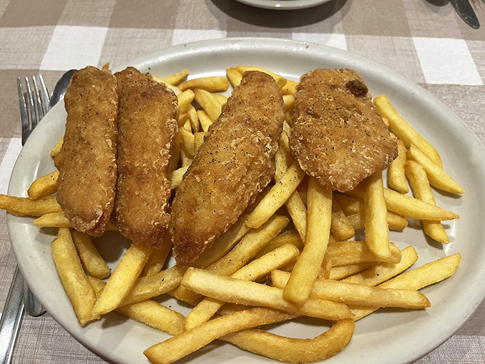Fish so perfectly fried it makes you wonder if there's an Amish secret to achieving that golden crust that shatters like glass.