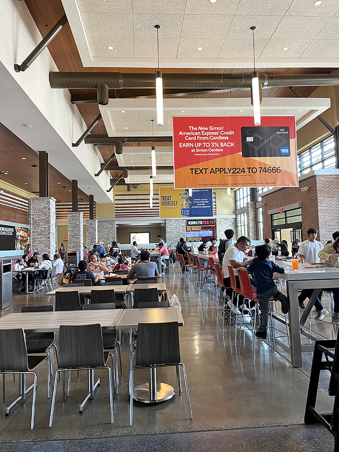 The food court: retail's natural intermission where hungry shoppers refuel while surrounded by the day's conquests in branded shopping bags.