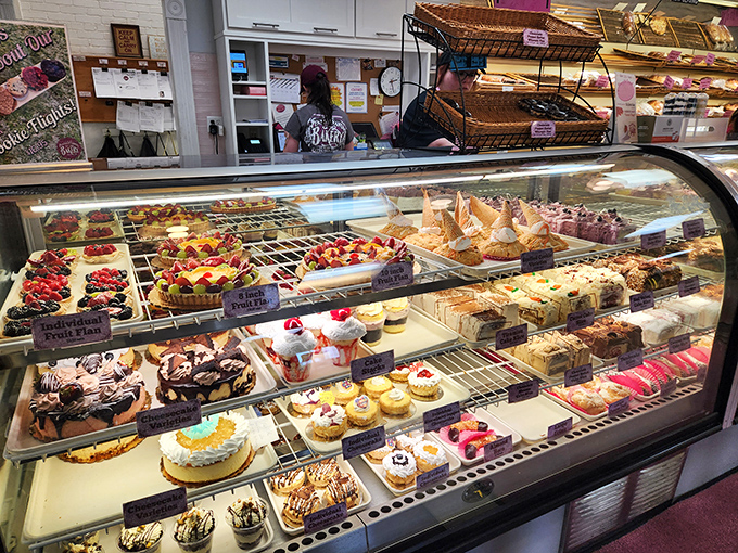 This display case isn't just showing desserts; it's exhibiting edible art that makes museum paintings seem like they're not pulling their weight.