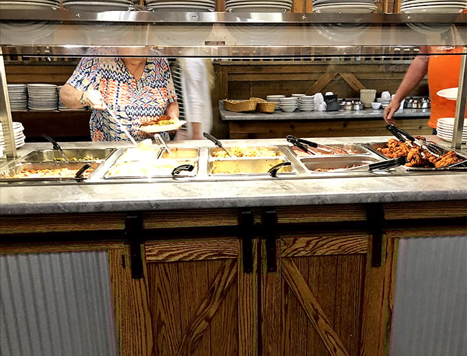 The buffet line &ndash; where dreams are made and diets go to die. Notice how everyone takes a little extra when they think no one's watching.