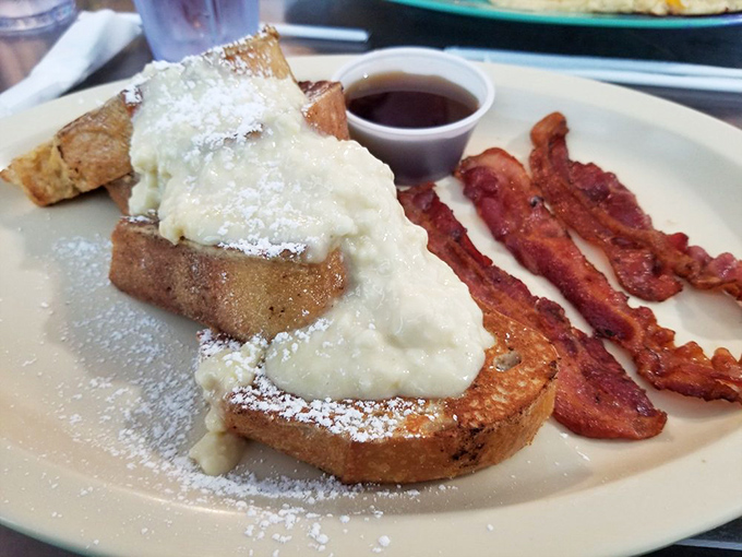 French toast that's dressed for success with powdered sugar snow and a cream topping that should be illegal before noon.