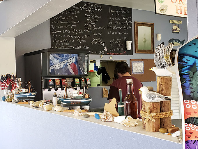 Nautical knickknacks line the counter, reminding you that the ocean—and your next perfect bite of seafood—is just steps away.