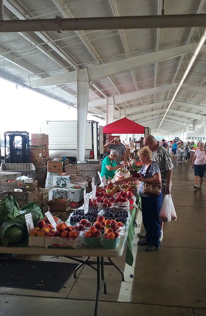 Nature's candy lines these tables in perfect, colorful rows. The produce section is where Amish farming traditions meet modern appetites.