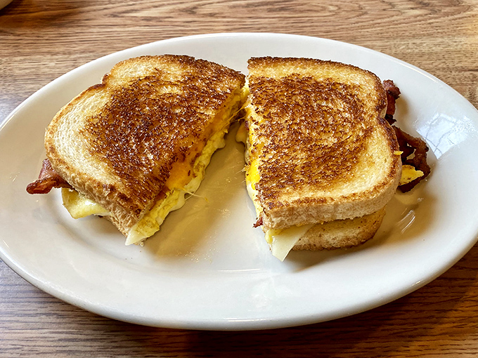 The humble grilled cheese, elevated to art form. That golden-brown exterior gives way to a molten center that makes you question why anyone eats anything else. 