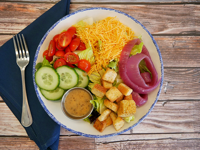 A house salad arranged with the precision of a color wheel artist&mdash;proof that vegetables can dress up for dinner too.