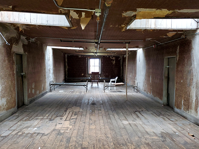 Institutional minimalism at its most haunting&mdash;bare walls, simple beds, and the lingering question of how many souls called this sparse room home.