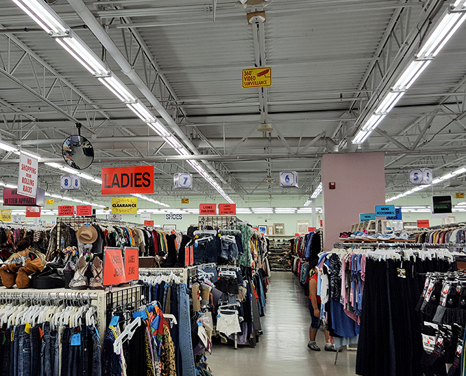 Department store organization meets treasure hunt excitement. The "Ladies" sign points the way, but the journey is the real adventure.