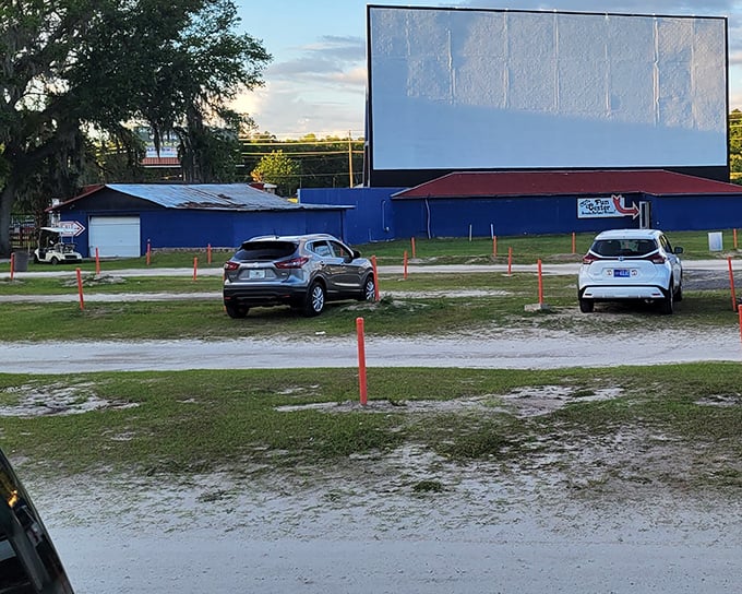 As dusk settles, the screen awaits its transformation from white rectangle to storytelling portal&mdash;the calm before the cinematic storm that brings communities together.