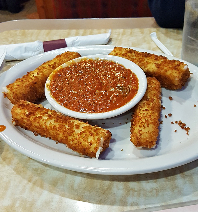Mozzarella sticks&mdash;the golden guardians of marinara lake, crispy on the outside with that perfect cheese-pull moment that makes life worth living.