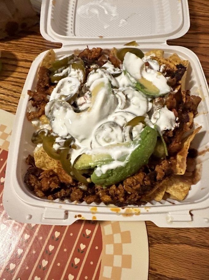Nachos that understand the importance of proper distribution. Every chip gets its fair share of toppings in this democratic approach to deliciousness.