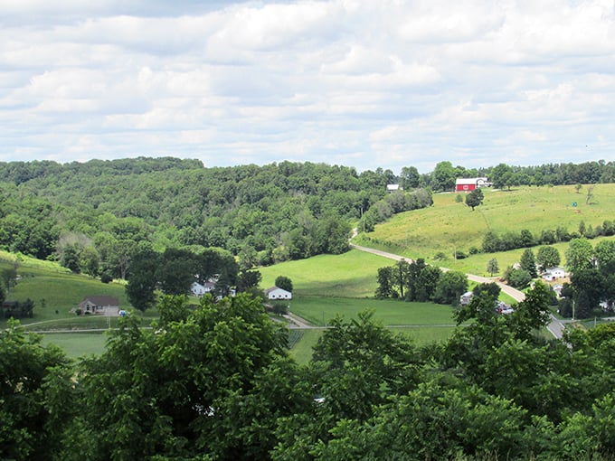 Layers of green hills stretch to the horizon, a landscape so serene it feels like nature's version of a deep breath and long exhale.