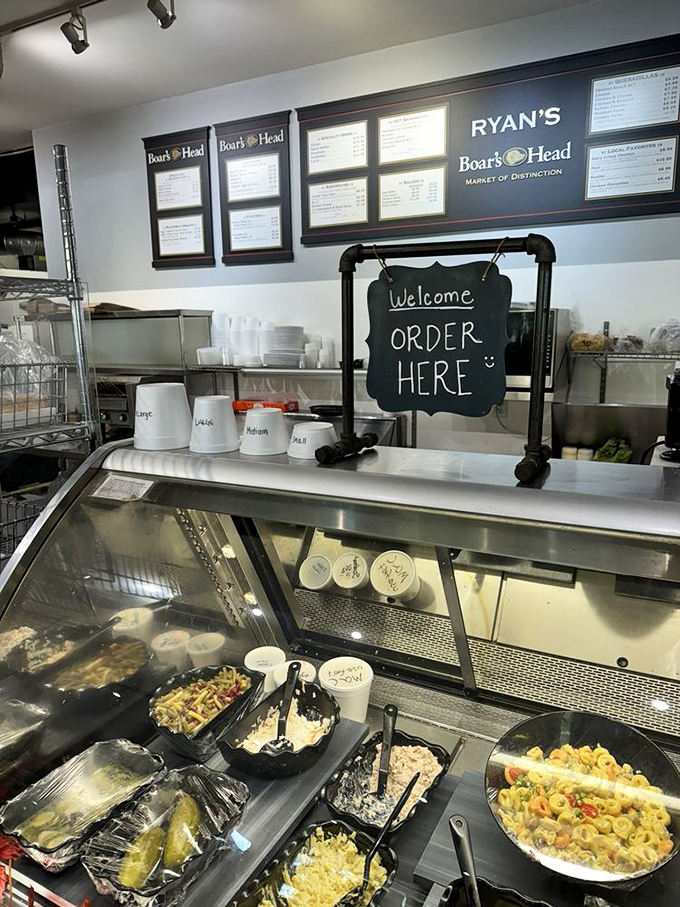 The "Order Here" sign might as well say "Dreams Fulfilled Here" as the prepared foods behind the counter promise satisfaction in every scoop.