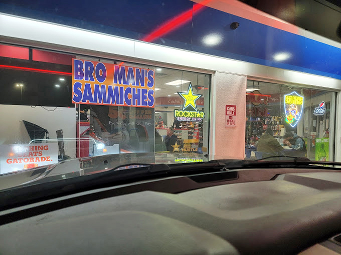 Night falls, but the Bro Man's sign shines bright, guiding hungry souls to burger nirvana. Some of the best meals happen after dark.