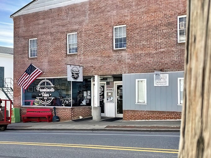 A brick facade that's weathered decades – the Franklinville Diner stands proudly on Main Street, an American flag waving like a culinary battle standard.