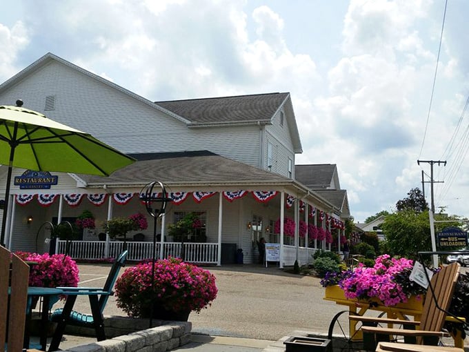 The porch: where rocking chairs and hanging flower baskets create the perfect prelude to the feast that awaits inside.