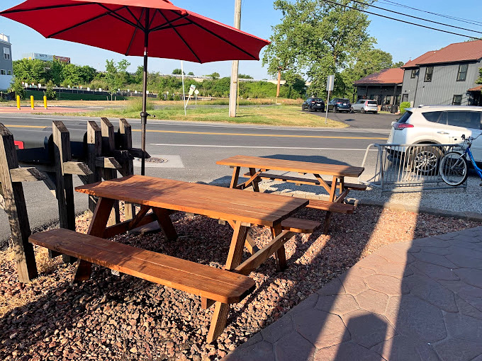 Outdoor seating where you can savor your purchases while watching the world go by contentedly.