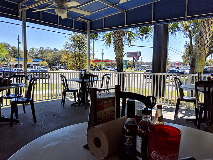 The outdoor seating area offers fresh air, palm trees, and the perfect spot to enjoy your seafood while watching the world go by.