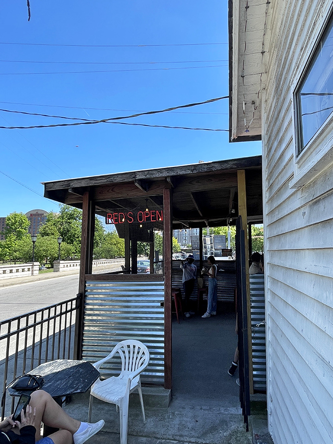 The outdoor dining area with its "Red's Open" sign beckons heat-seekers from across Nashville. Even on the hottest days, this patio fills with those pursuing spicy enlightenment.