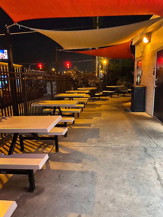 The outdoor seating area &ndash; where summer nights turn magical as the smell of smoked meat mingles with Baltimore's evening air under simple canvas sails.