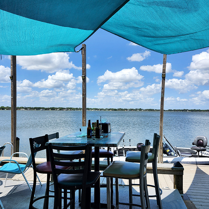 A table with a view that makes you wonder why anyone would ever eat indoors in Florida again.