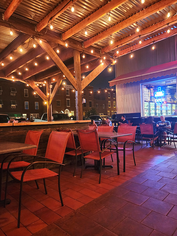 The outdoor seating area, where string lights create the perfect ambiance for enjoying Philadelphia's finest sandwiches under the stars.
