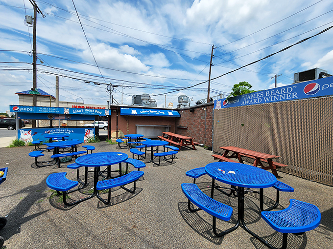 The outdoor seating area isn't fancy, but neither are life's best moments. Blue tables under open sky&mdash;the perfect stage for sandwich bliss.