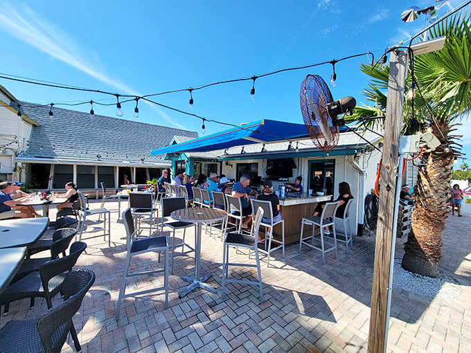Outdoor seating that reminds you why people move to Florida in the first place &ndash; sunshine, palm trees, and drinks within arm's reach.