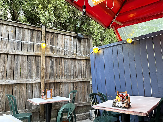 The outdoor seating area offers a casual escape, where string lights create just enough ambiance without distracting from the seafood main event.