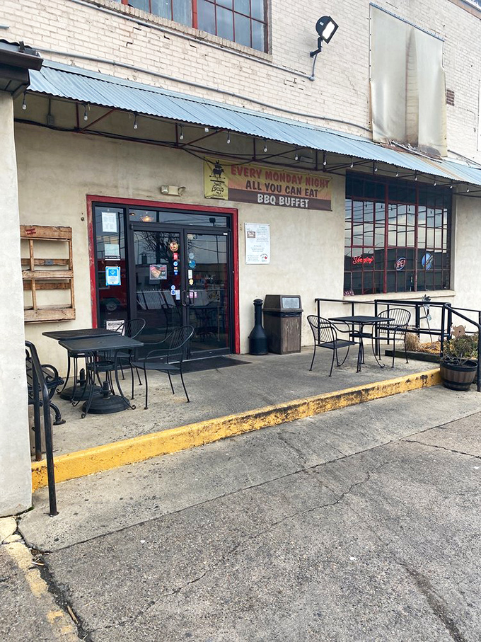 The unassuming entrance that doesn't need flashy signage when the aroma of smoked meat works better than any billboard ever could.