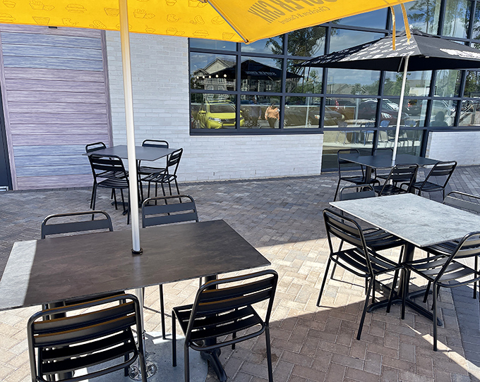 Al fresco dining, Super Chix style. These outdoor tables offer the perfect spot to savor crispy chicken while soaking up some Carolina sunshine.