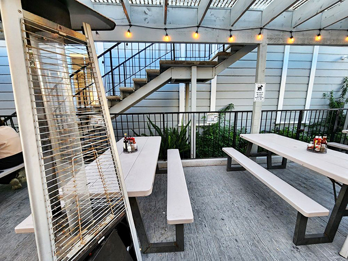 The outdoor seating area &ndash; where the ocean breeze enhances every bite, and strangers become friends over shared recommendations and seafood euphoria.