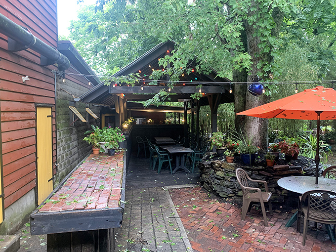 The outdoor seating area offers a breath of fresh air under string lights and greenery&mdash;nature's dining room with brick floors and zero chance of rain in your soup. 