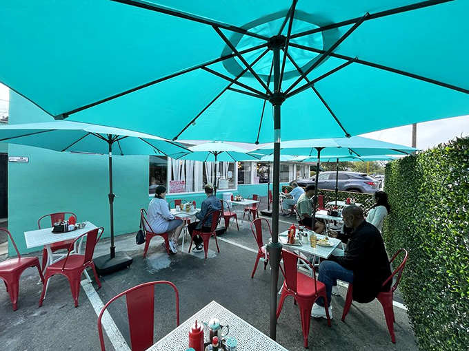 Outdoor seating that matches the building's distinctive color scheme&mdash;because when you've found your signature look, you commit to it completely.