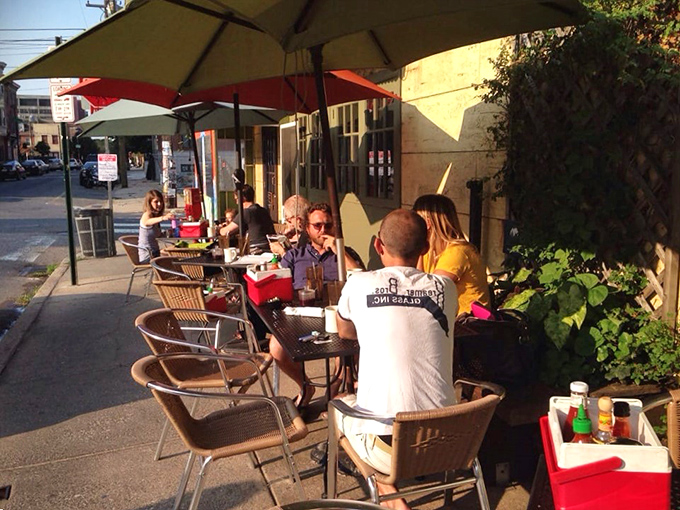 Outdoor seating under colorful umbrellas&mdash;where Philadelphia's breakfast enthusiasts gather to enjoy morning masterpieces in the fresh air.