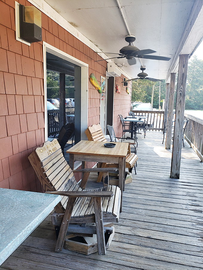 The porch where waiting for a table becomes part of the experience. Those wooden chairs have supported generations of pre-crab anticipation.