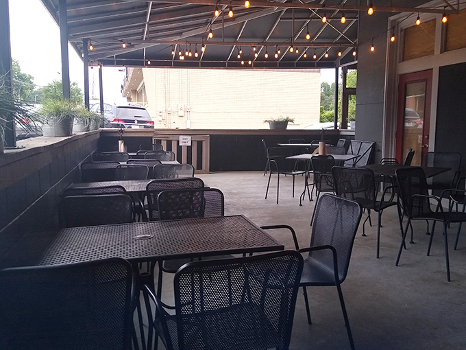 The outdoor seating area, where string lights create ambiance and fresh air somehow makes barbecue taste even better. Your office lunch break just got a serious upgrade.