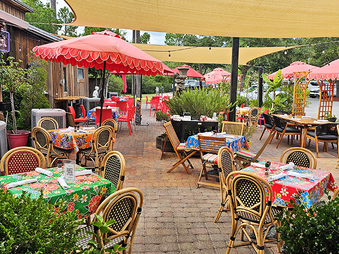 The outdoor patio feels like dining in a secret garden, where colorful umbrellas and tablecloths compete with the food for most vibrant experience.