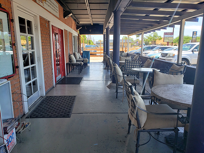 The outdoor seating area awaits your post-BBQ food coma. Those chairs aren't just furniture&mdash;they're recovery stations for the gloriously overstuffed.