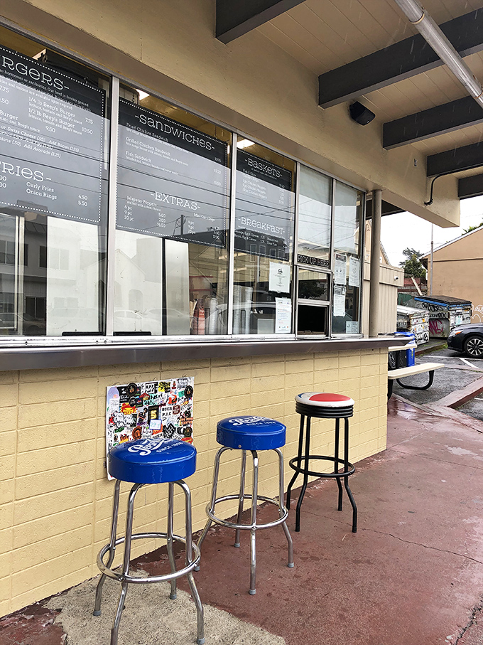 The blue stools and simple counter setup say, "We're focusing on what matters here&mdash;and that's what's coming out of the kitchen."