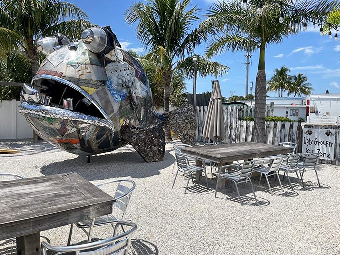 Outdoor seating with that iconic sculpture creates Instagram-worthy moments between incredible bites of grouper.