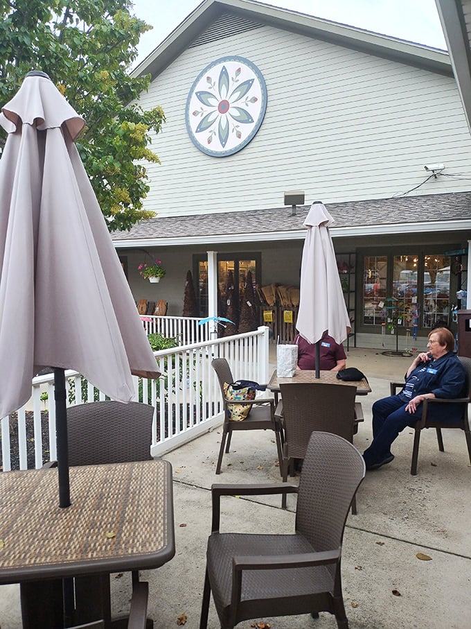 The outdoor seating area offers a chance to contemplate your food choices while planning your next meal. The quilt-inspired wall art reminds you this is Amish country.