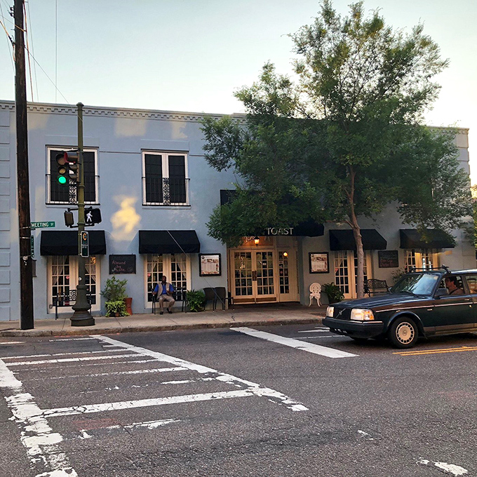 Evening light on Meeting Street reminds us that great breakfast spots become neighborhood treasures worth protecting and celebrating.