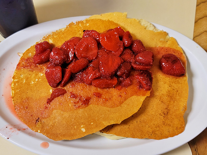 Pancakes topped with strawberries so vibrant they look like edible rubies&mdash;the perfect sweet counterpoint to all that savory goodness.
