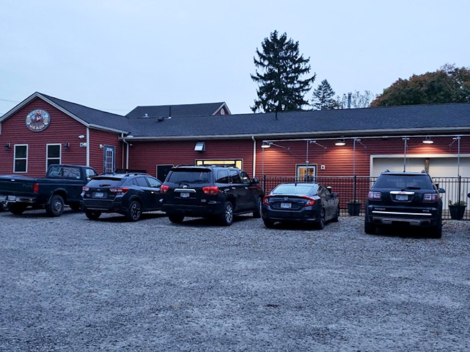 A full parking lot tells you everything you need to know. The gravel lot might not be fancy, but it's filled with vehicles belonging to people making excellent life choices.