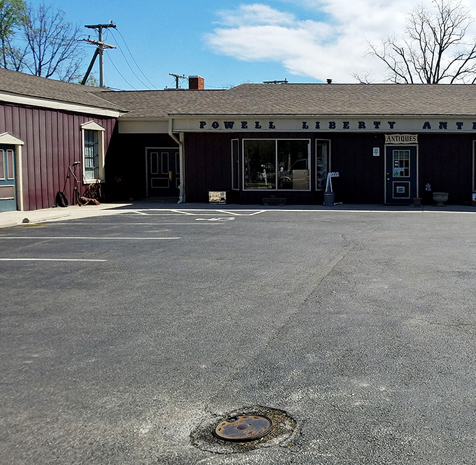 Even the parking lot has character, with the Powell Liberty Antique Mall sign promising adventures in collecting for anyone willing to step through that blue door.